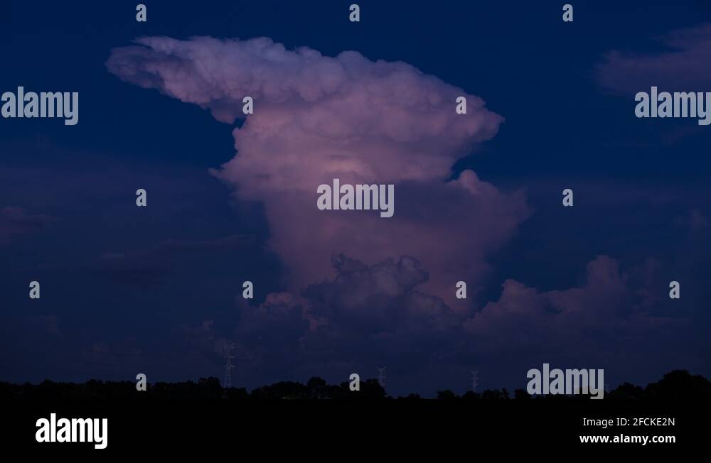 Storm cloud rising and flashing during South East Asia monsoon season ...