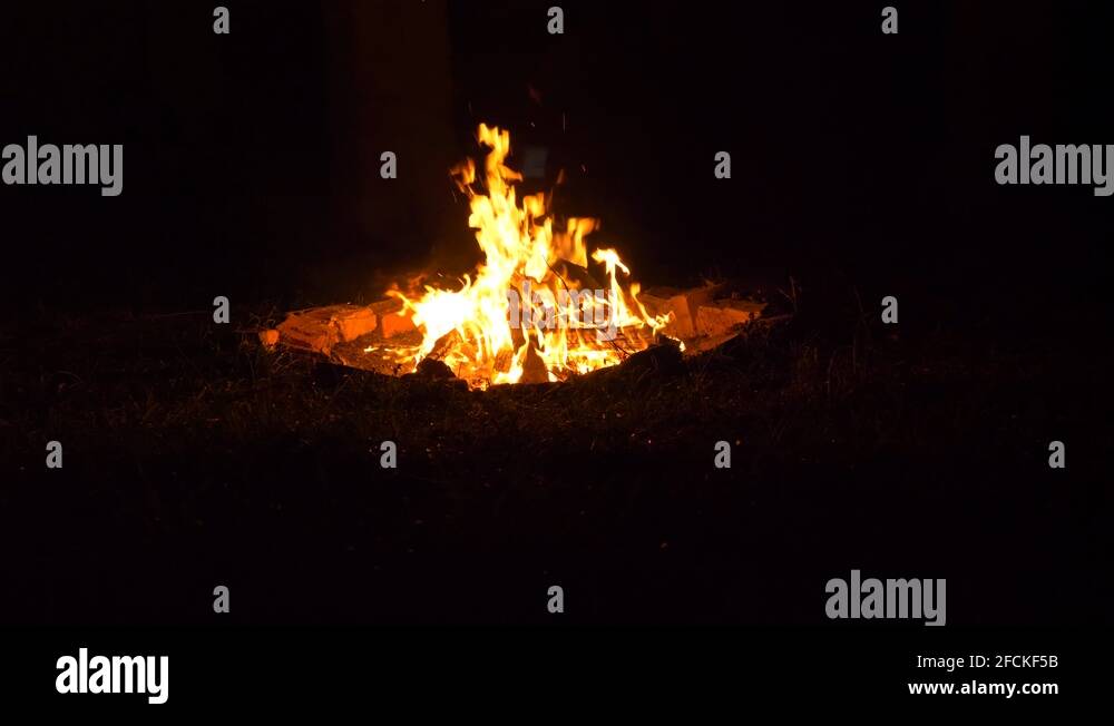 Man Jumps Across Fire Flames, Comes In And Goes Out Of Frame Stock ...