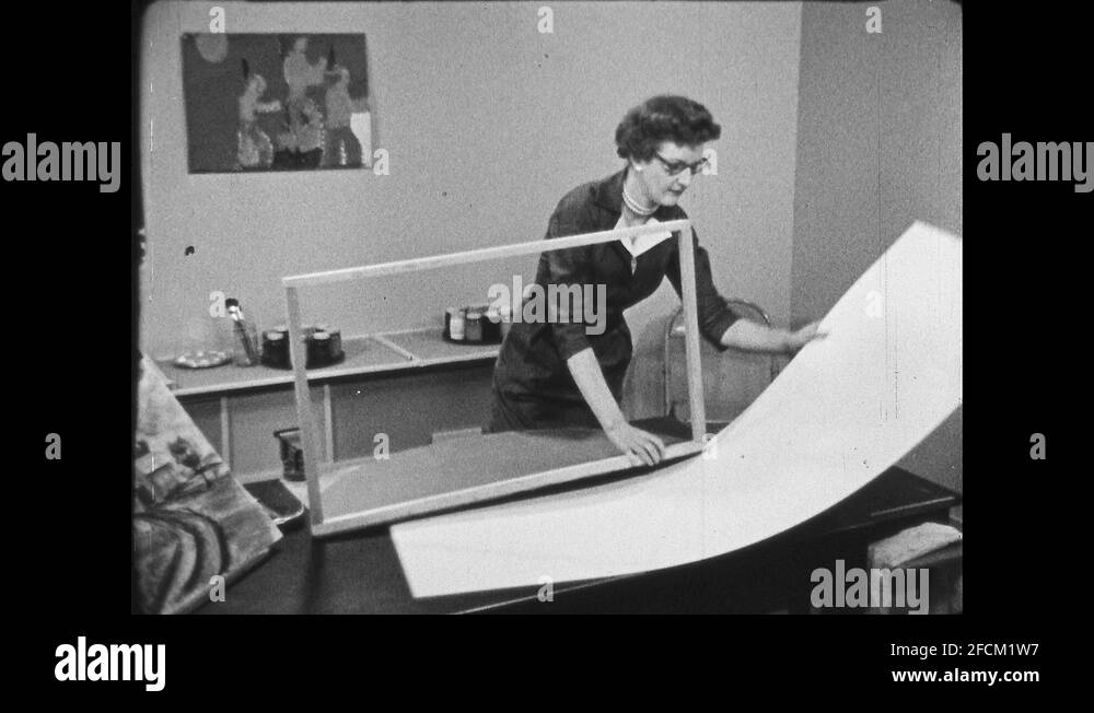 1950s: UNITED STATES: lady adds background to base of diorama. Lady ...