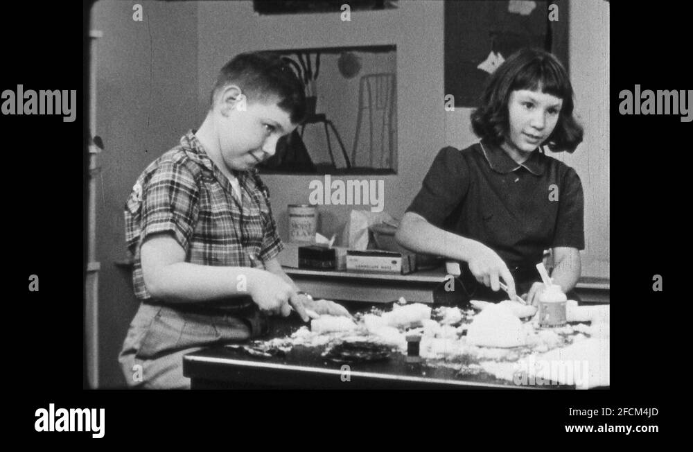 1950s: UNITED STATES: student shell teacher make diorama. Lady and ...