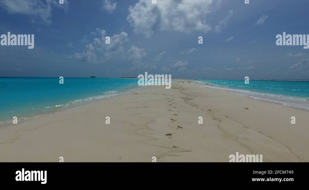 Smooth video showing perspective from a narrow beach in the middle of ...