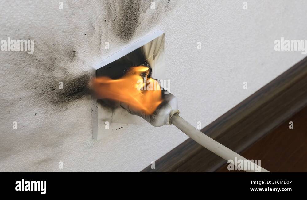 burning socket from short circuit in house Stock Video Footage - Alamy