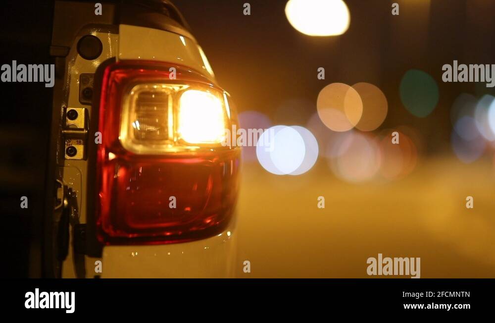 Flashing red tail light on side of road Stock Video Footage - Alamy