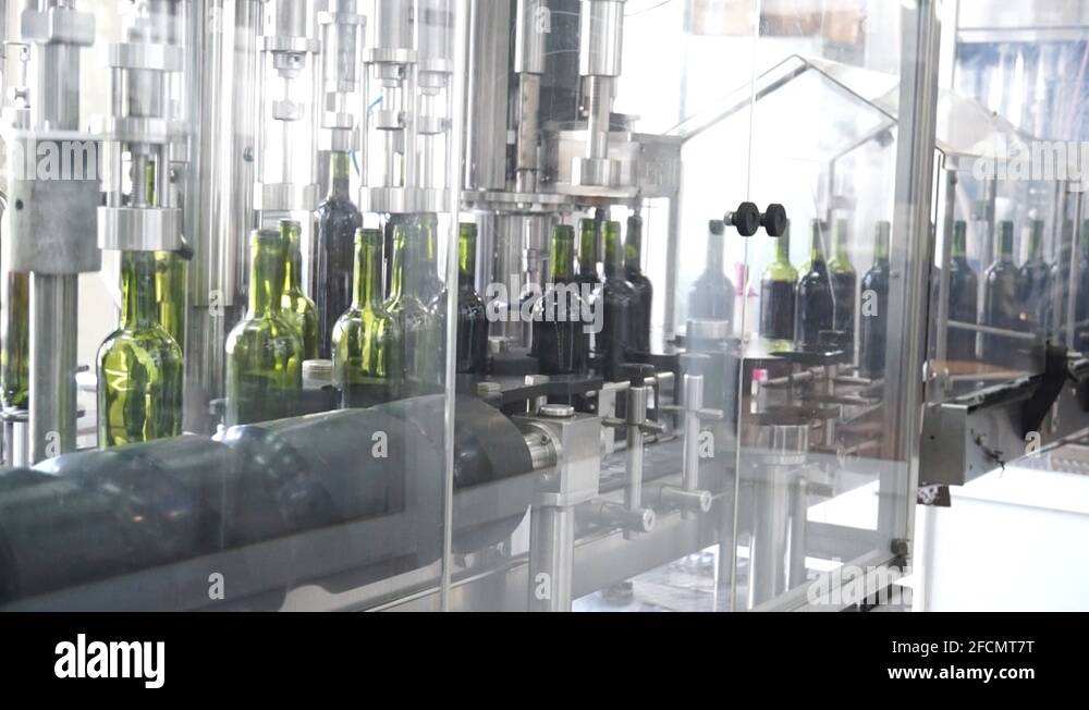 Bottles filled wine bottling machines Stock Videos & Footage - HD and ...