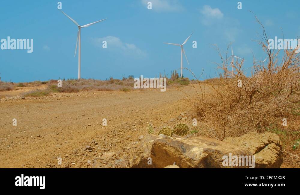 Windturbines spinning in dry season, Curacao Stock Video Footage - Alamy
