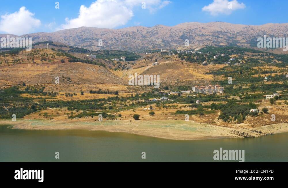 Zoomed in panning view of the mountains behind Litani River, the ...