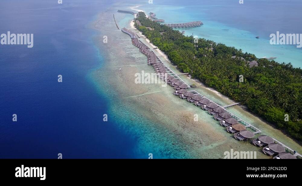 Viewing a tropical haven from above. Small island peninsula with ...