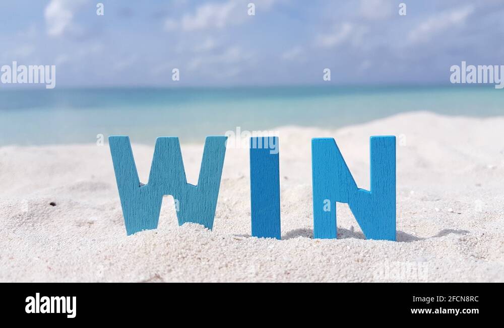 Word WIN written by big blue letters plunged on white beach in a static ...