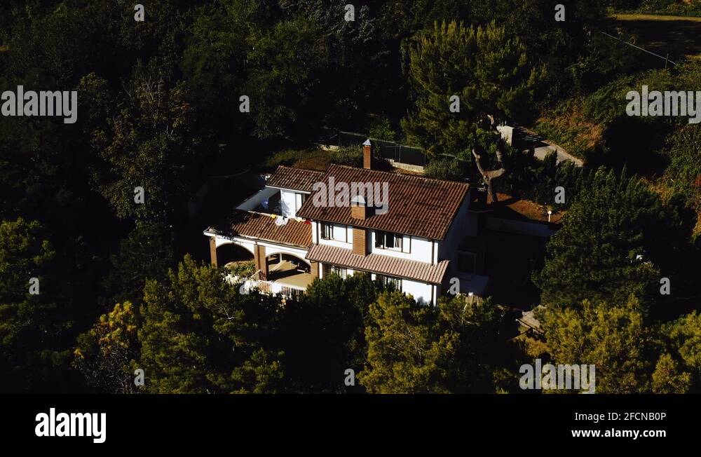 Drone zooming out above beautiful house mansion in Italy surrounded by ...