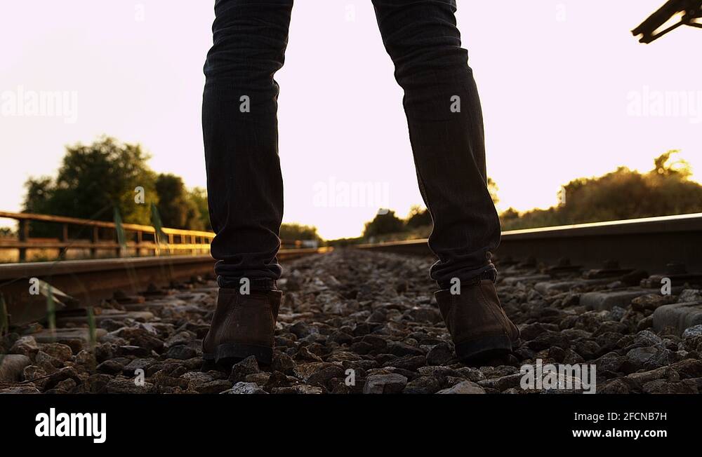 Low angle shot male feet shoes and lower body legs standing and turning ...