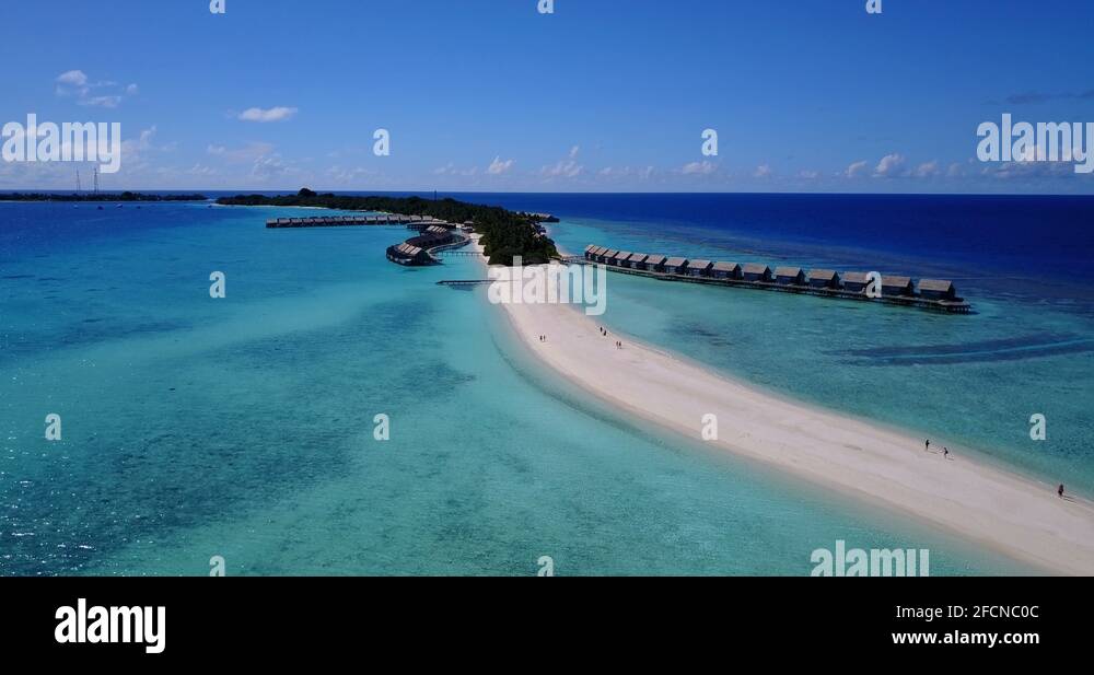 Tropical island and Long rows of bungalows on shore of Pulau Sebatik ...