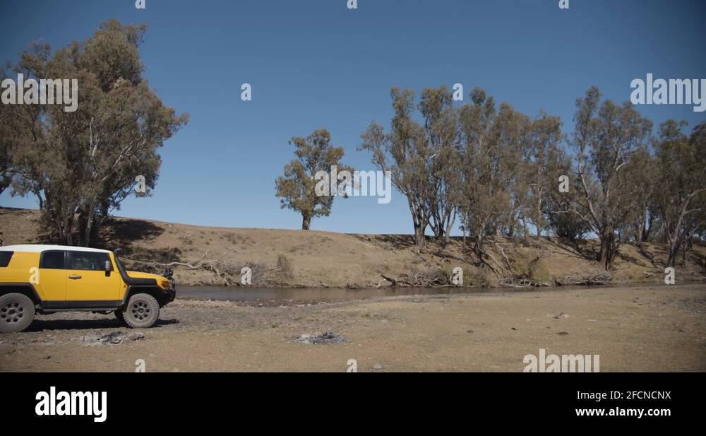 Yellow car with caravan camping at Ponto Falls Reserve Stock Video ...