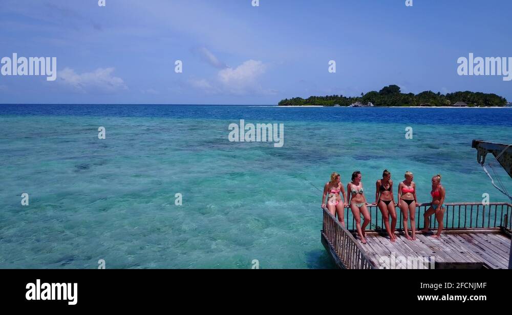 beautiful young women sunbathing on the floating wooden raft in the ...