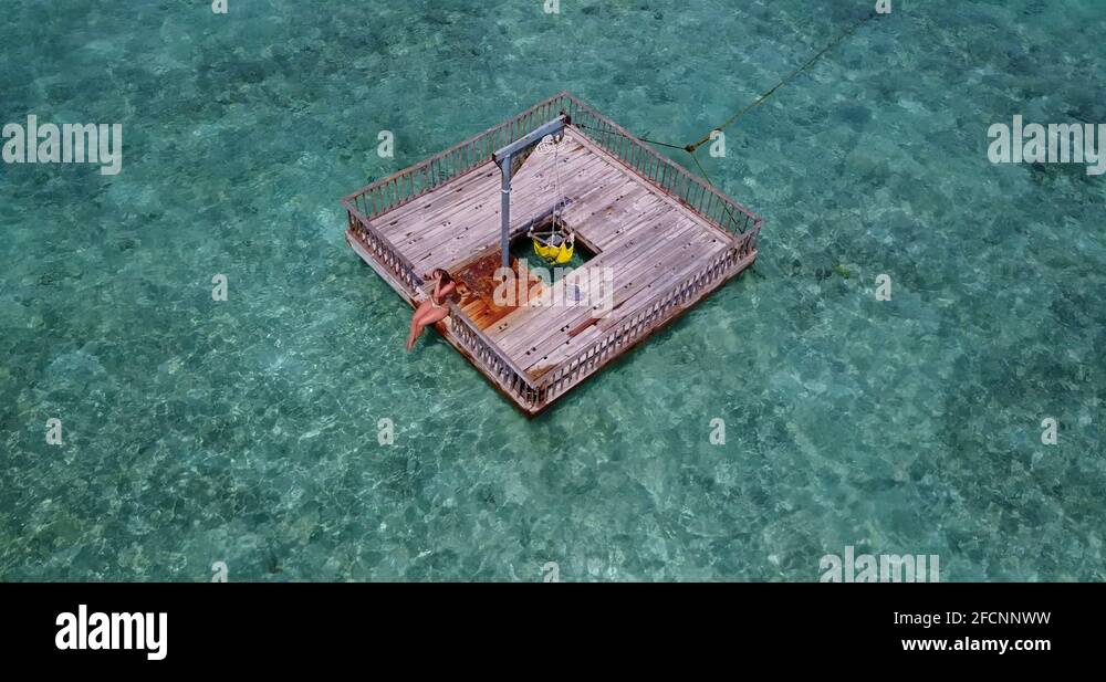 Sexy woman lady girl floating sunbathing raft in the middle of the ...