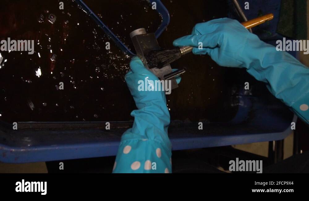 Cleaning desktop CNC lathe part with brush in 20 gallon parts washer ...