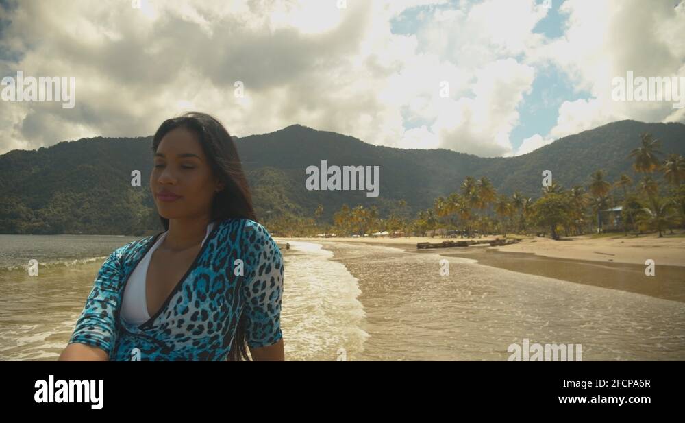 Beautiful model posing at a beach on the Caribbean island of Trinidad ...