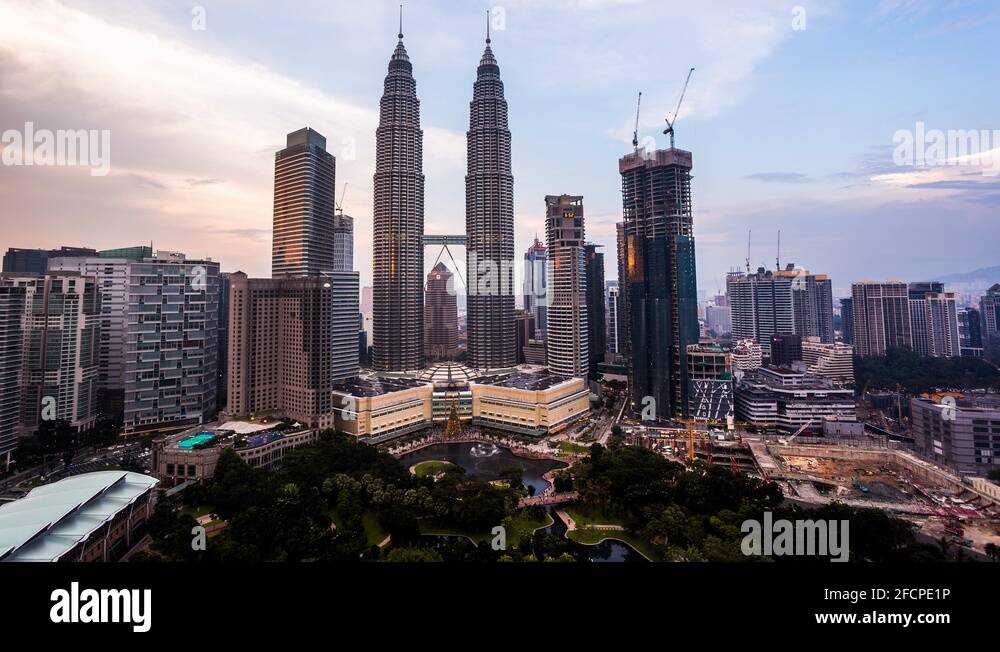Petronas Twin Towers (KLCC) in Kuala lumpur day to night time lapse ...