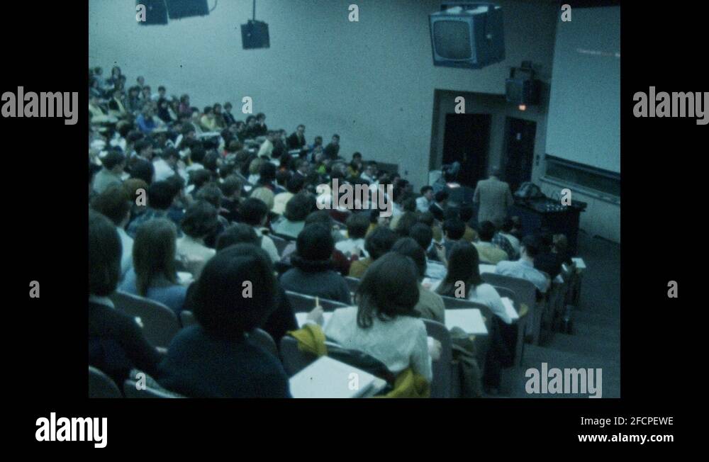 1970s: UNITED STATES: view across lecture hall towards professor ...