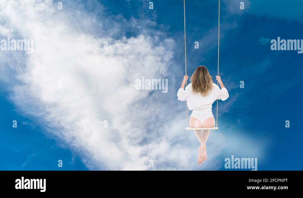Girl on swing looks at the cloudy sky while an airplane passes on the bottom Stock Video Footage ...