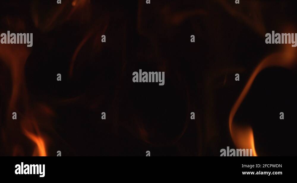 Slow motion flames burning around the edges of the frame. Subtle 4K ...