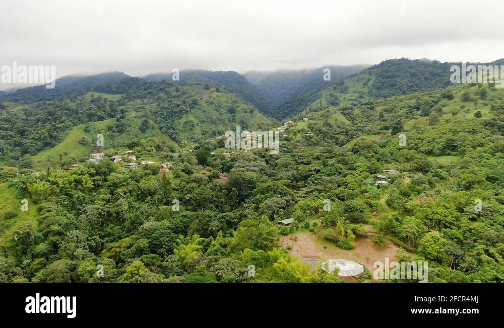 Rural village hidden in the mountains of Costa Rica. Aerial tracking ...