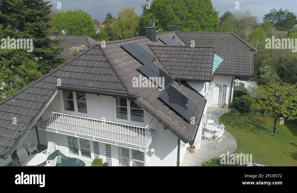 beautiful scene of an exotic, lovely,cute house with solar panel ...