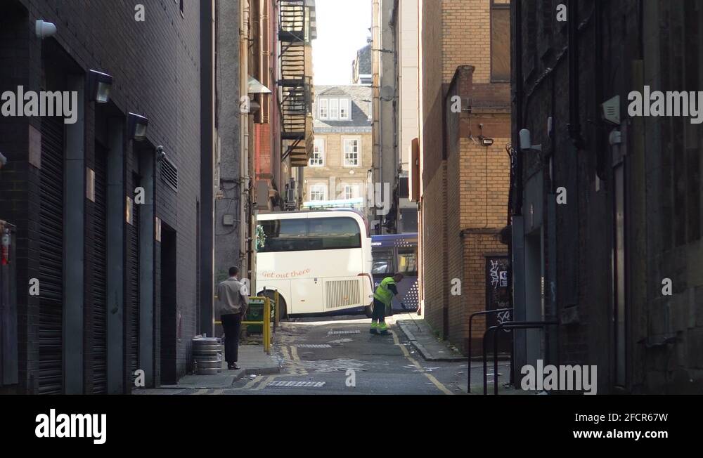 Telephoto of Alley Between Buildings With Traffic Driving on 3 Parallel ...