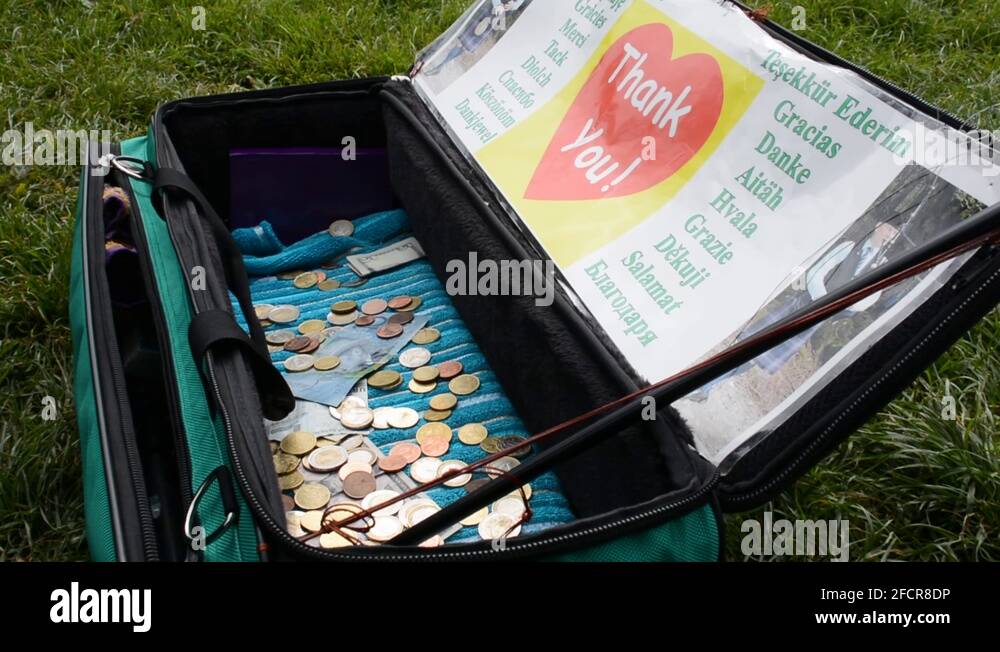 People Dropping Money in Suitcase with Thank You Sign and Multiple ...