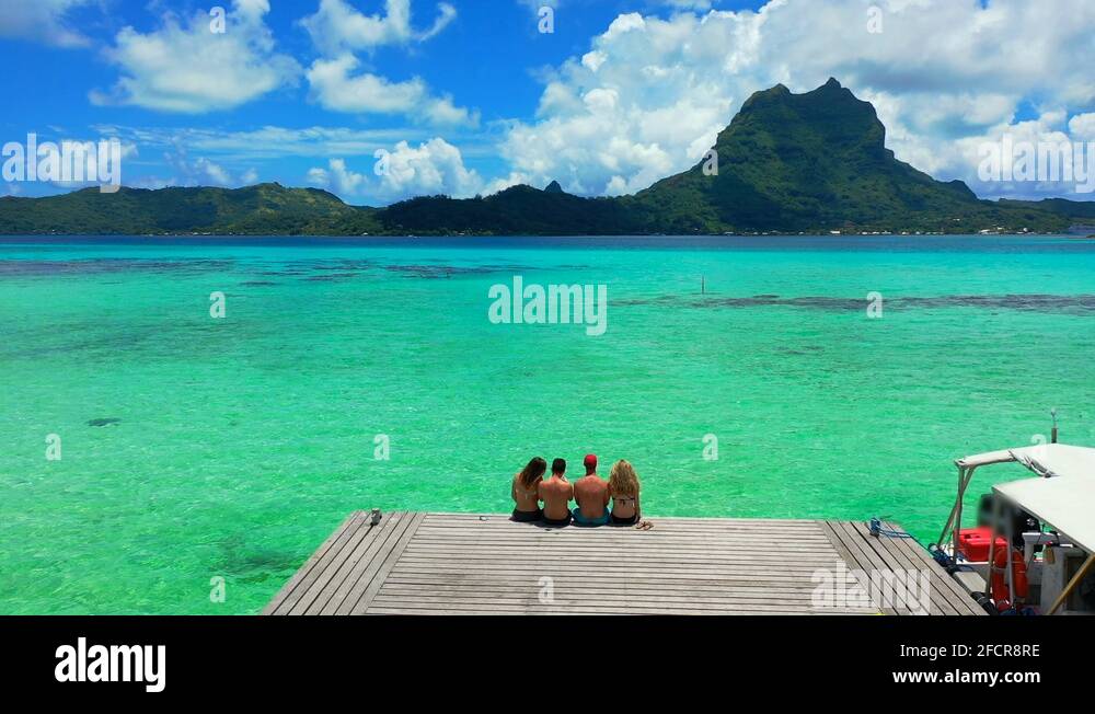 Back of two people sitting on dock Stock Videos & Footage - HD and 4K ...