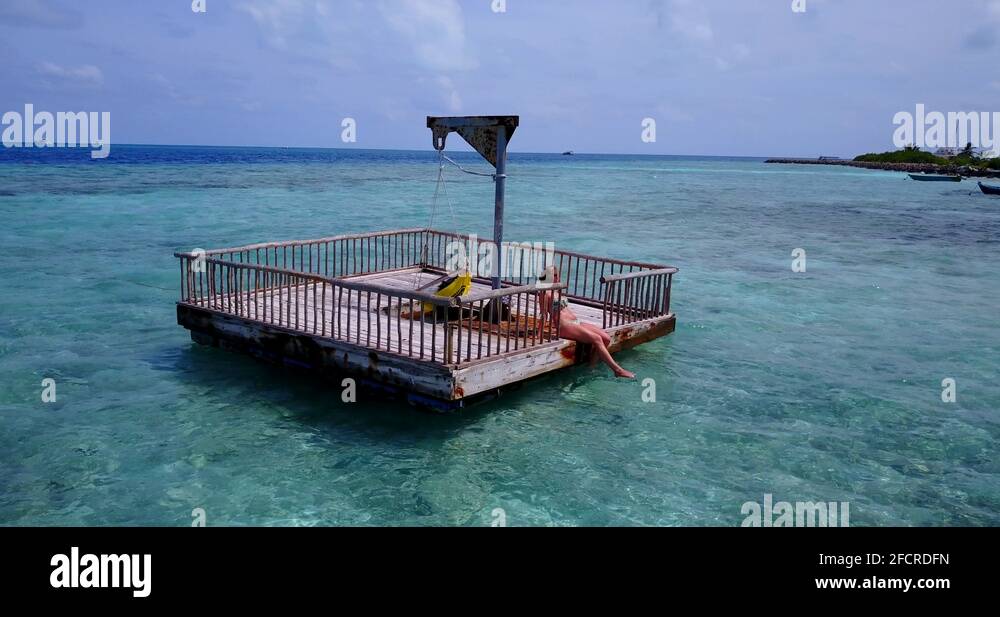 Woman sunbathing on a floating raft in Thailand Stock Video Footage - Alamy