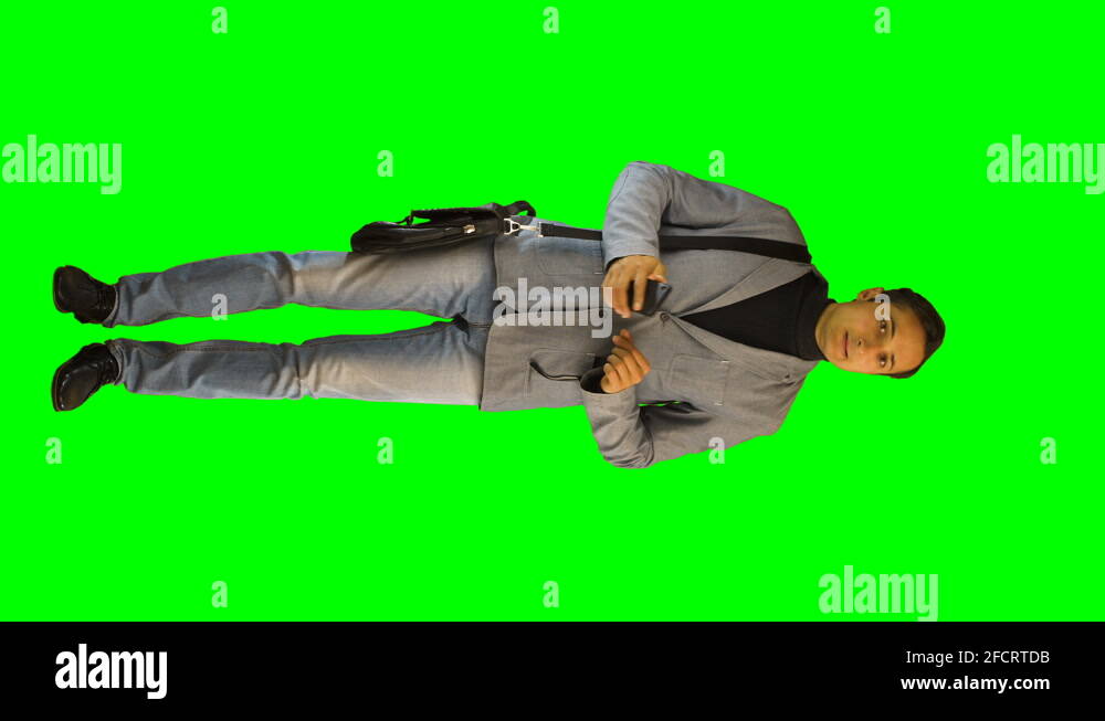 Man in a suit catches a taxi Isolated green screen Chroma key ...