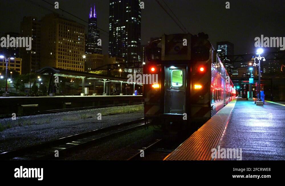 Metra train leaves station/platform to reveal skyline in downtown ...