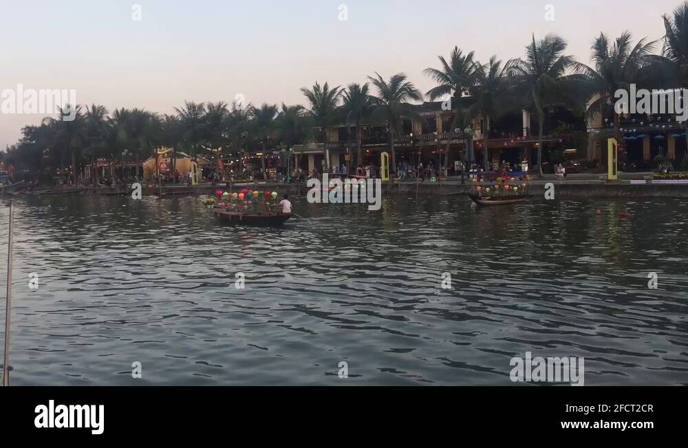 Crowded boat floating along the river near a crowded vietnam city Stock ...