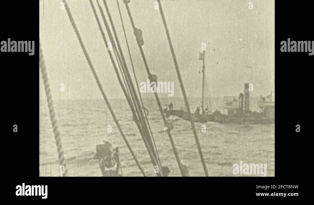 1930s: Fishing boats float out into ocean waves. Whaling ship passes by ...