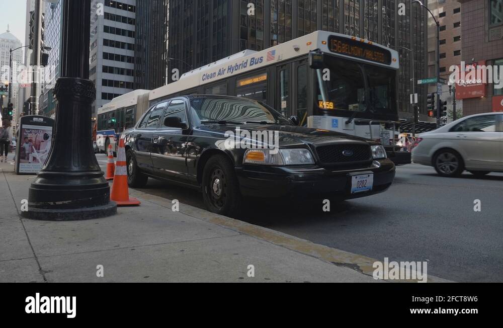 Unmarked police car parked on Lasalle in downtown Chicago Stock Video ...