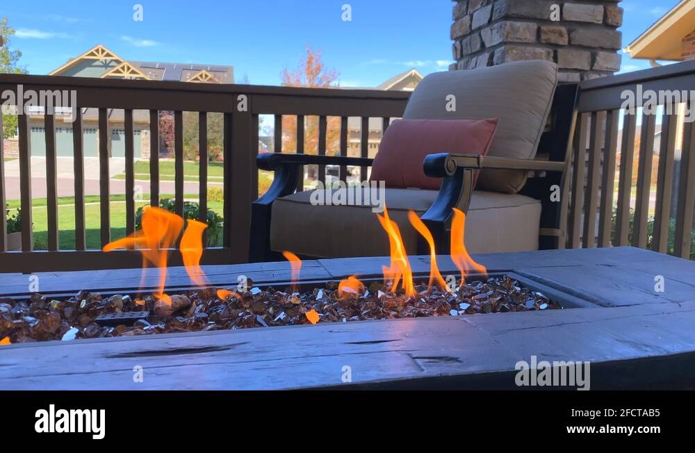 Video of a fire pit with flames and a chair on a front porch Stock ...