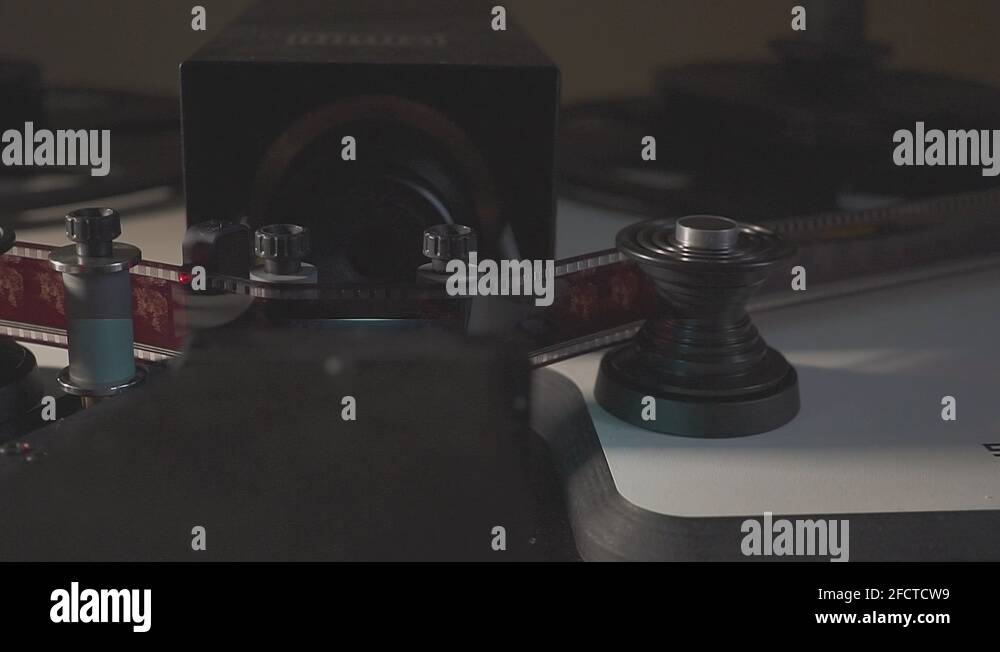 movie film strip. scanner is scanning 35 mm film to digital Stock Video ...