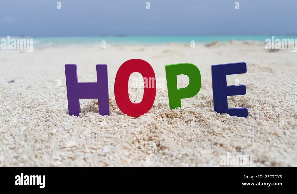 Hope on White Sand Beach Background with Green Ocean and a Bright Sky ...