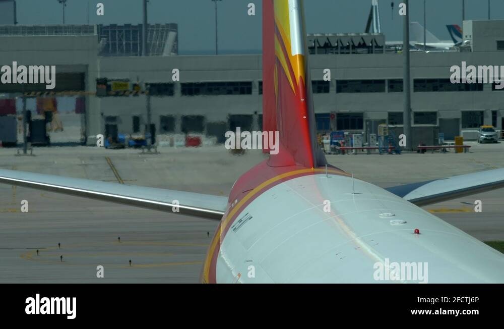 Detail of airliner aircraft tailplane with exhaust gases coming from ...
