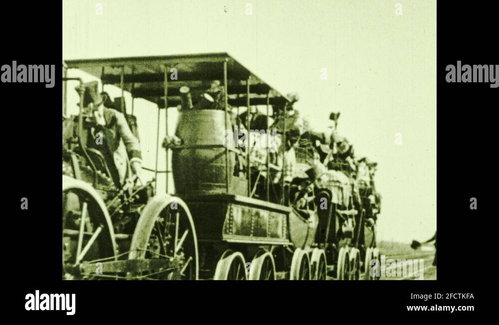 1930s: Passengers wave from the Dewitt Clinton, a steam train with ...