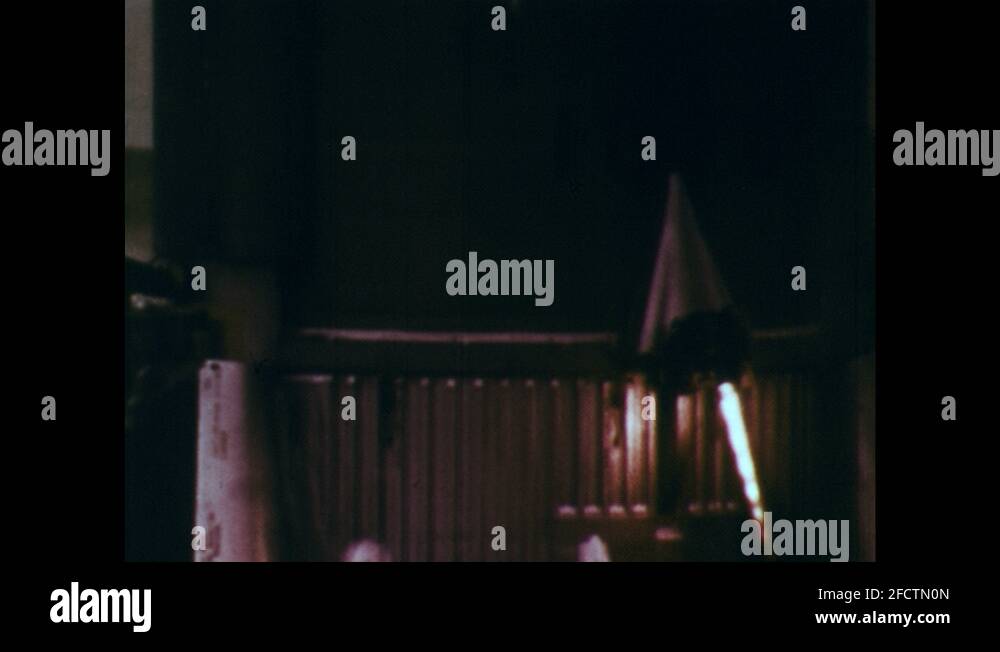 1960s: Rocket engines fire. Rocketship launches from pad and flies ...