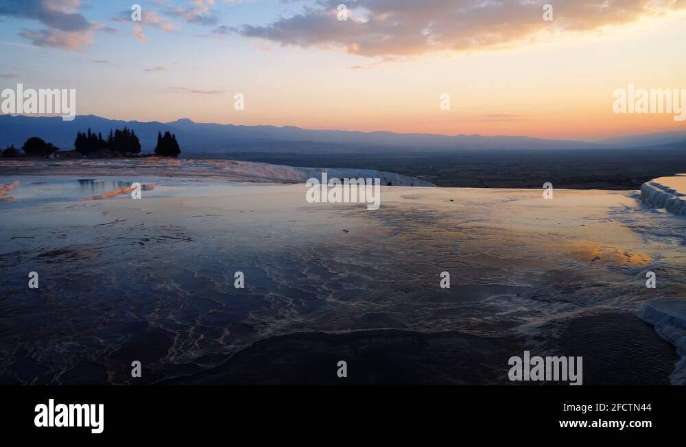 Water reflections of sun at Thermal hot springs and salt formations ...
