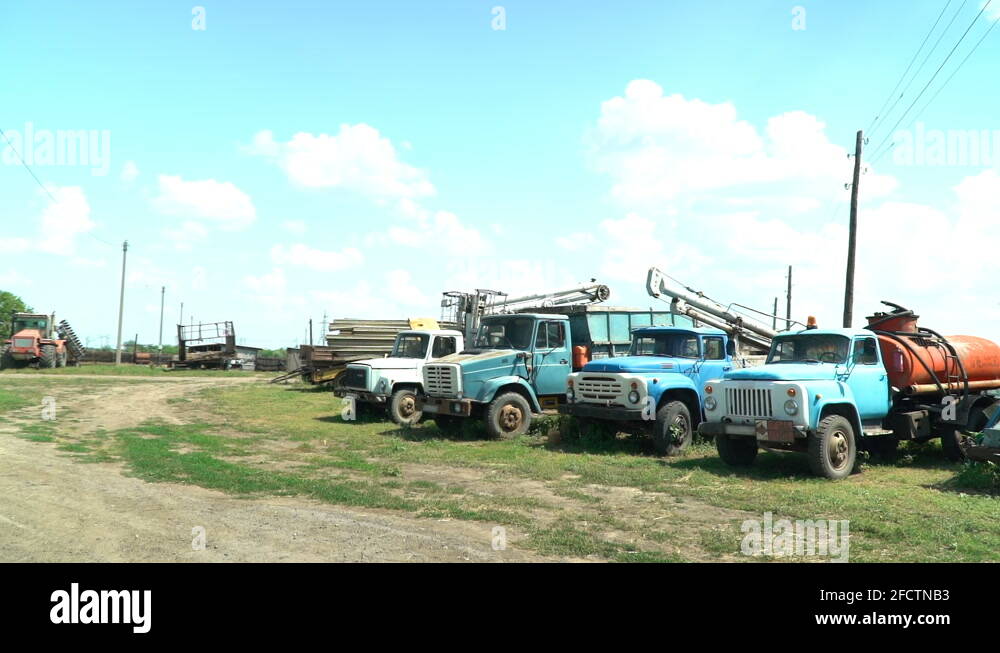 Old soviet trucks stand broken on the collective farm Stock Video ...