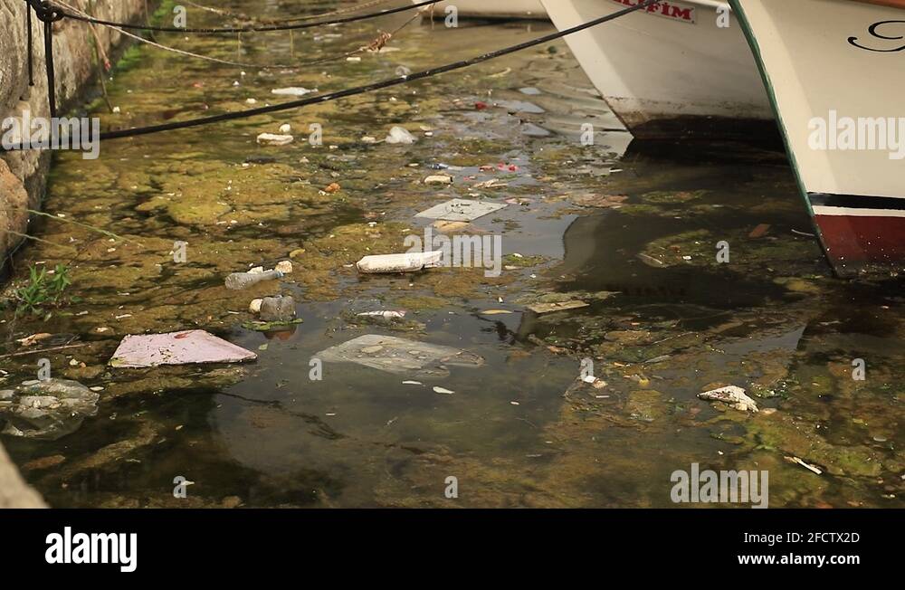 Environmental disaster, Sea water full of waste and plastics in a small ...
