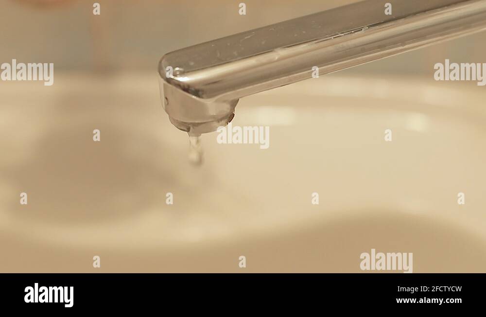 Water dripping from tap close-up, concept, save water and natural ...