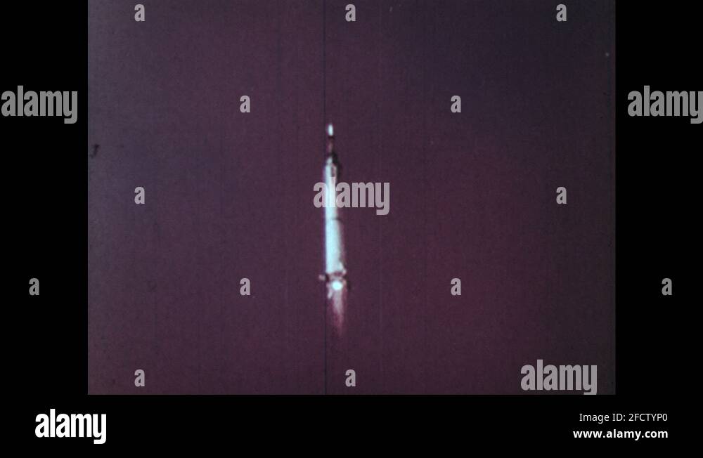 1960s: Rocket flies into space. Astronaut in spacesuit inside cockpit ...