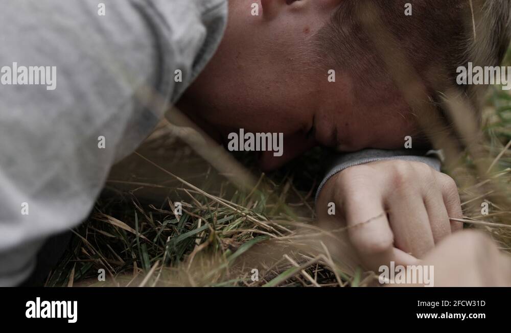 Depressed, sad teen boy crying on the ground Stock Video Footage - Alamy