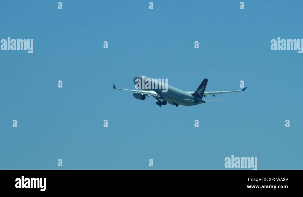 Wide body airliner aircraft departing after take off, landing gear in ...