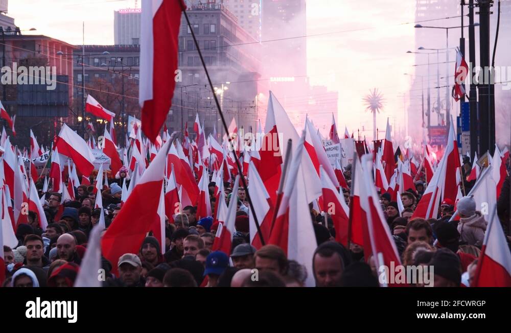 Polish citizens marching with flags waving on the 100th independence ...