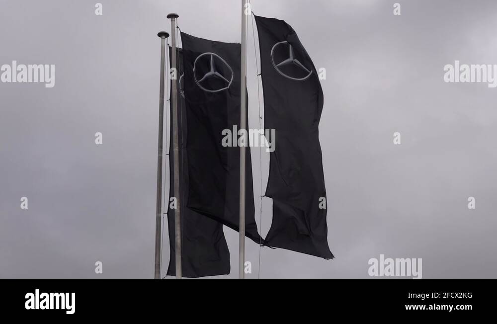 Flags with the Mercedes logo moving by the wind Stock Video Footage - Alamy